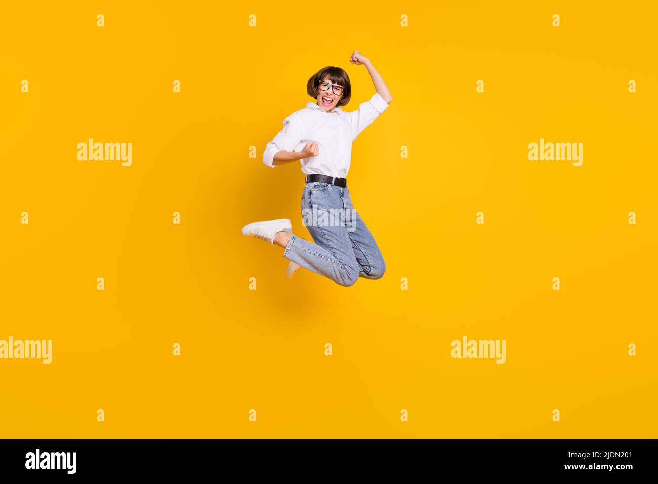 Photo of astonished successful lady jump rejoice wear specs white shirt ...