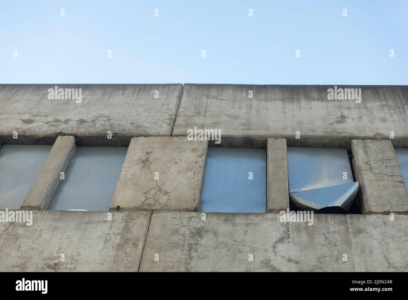 Windows closed with steel. Unfinished building. Abandoned house ...