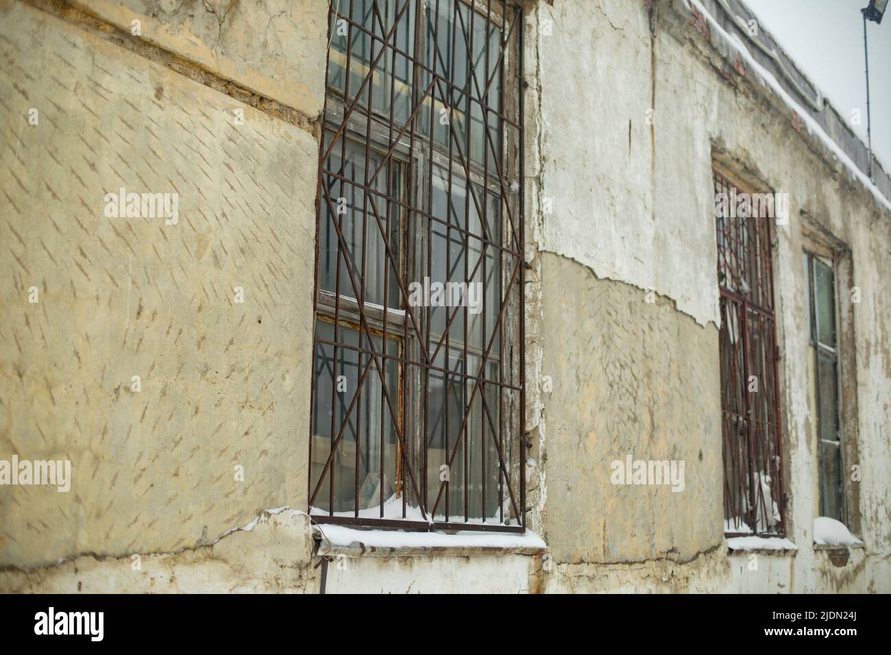 Window with grille. Old building. Steel bars on window. Industrial ...