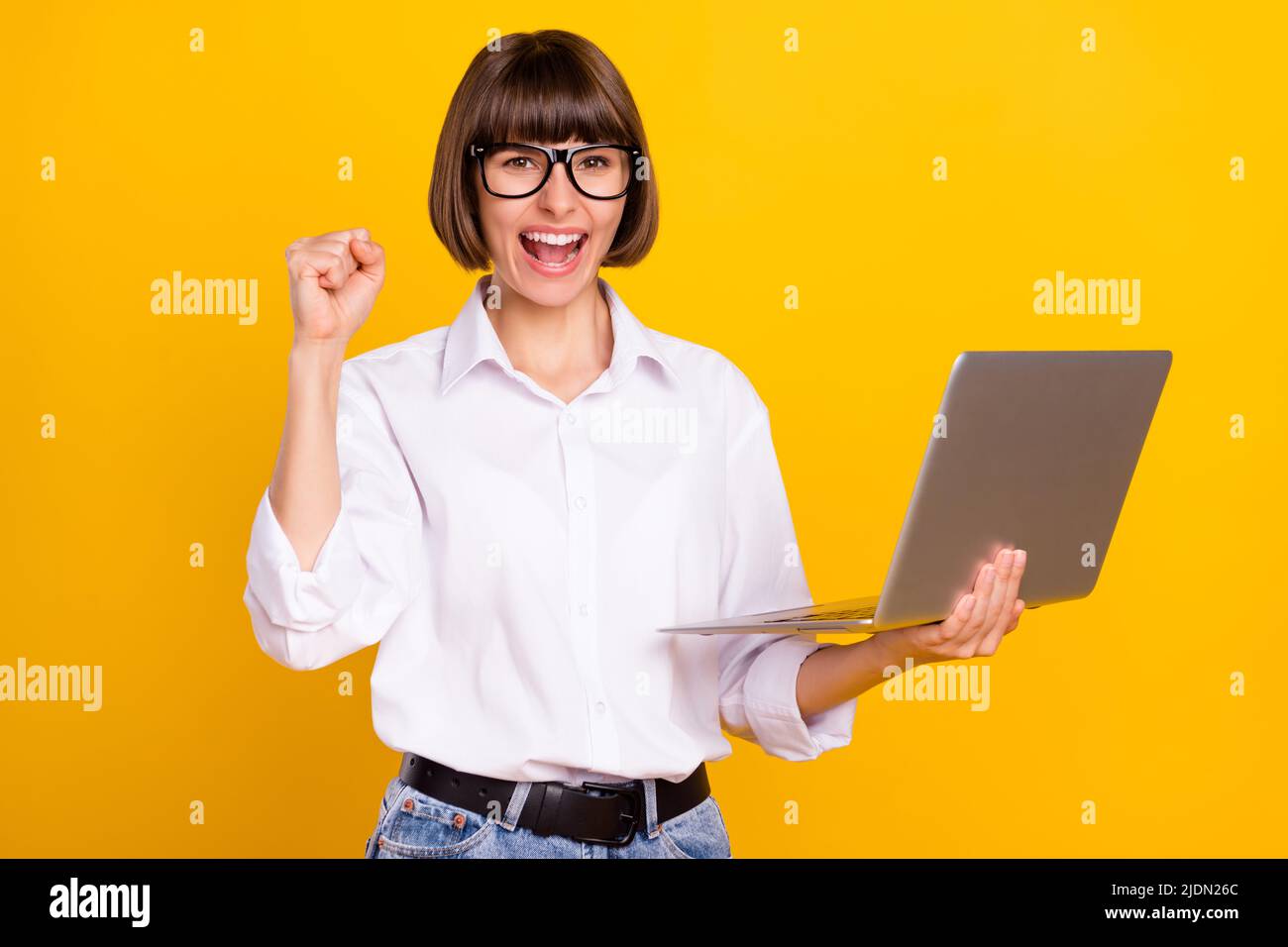 Photo of crazy lucky business lady hold pc celebrate triumph wear specs ...