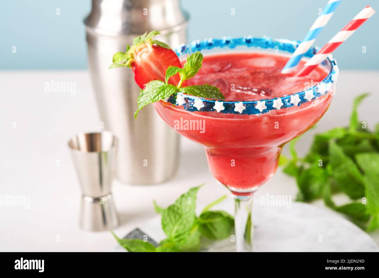 Patriotic Cocktail 4th july. Glass margarita cocktail with strawberry ...