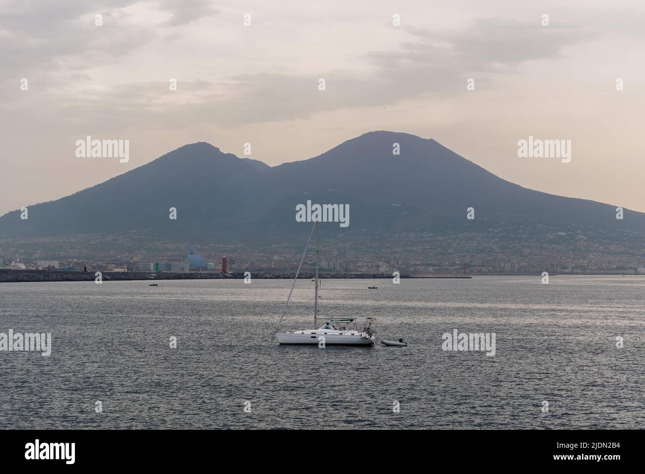 Sailboat on Gulf of Naples on the Mediterranean sea with Mount Vesuvius ...