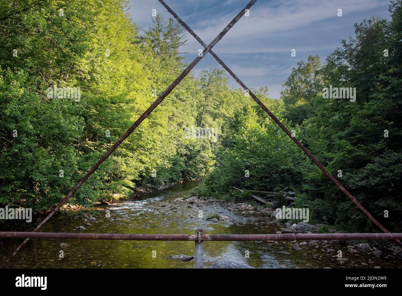Metal bridge support beams cross over the Pidgeon River in North ...