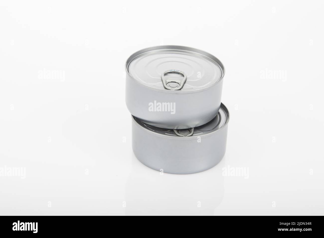 two cans of tuna on white background Stock Photo - Alamy