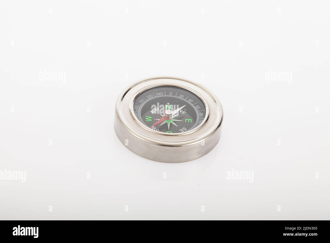 Compass on neutral background Stock Photo - Alamy