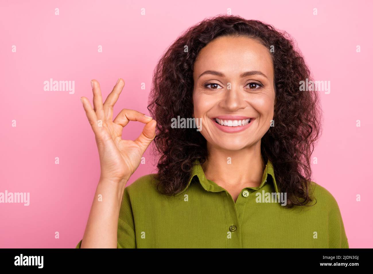 Photo of positive cheerful happy afro american woman show okay sing ...