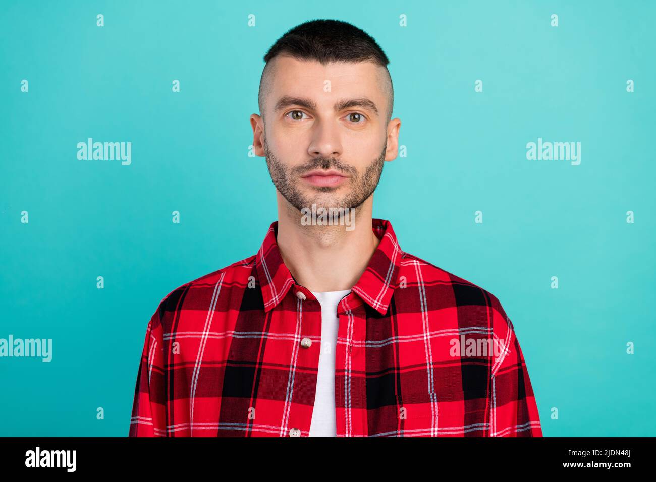 Photo of nice young brunet guy wear red shirt isolated on teal color ...