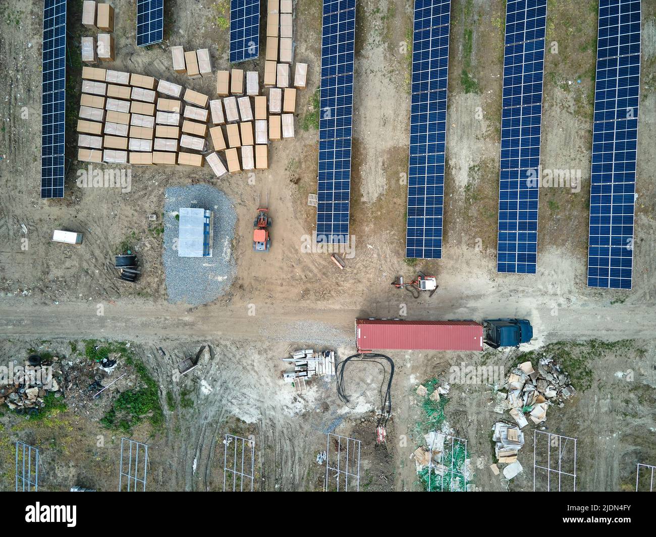 Aerial view of electrical power plant under construction with truck ...