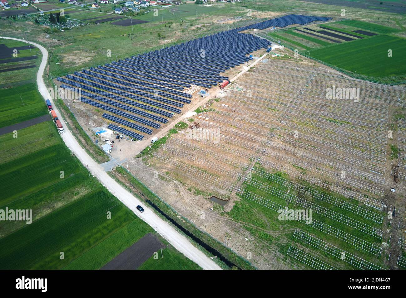 Aerial view of electrical power plant under construction with truck ...