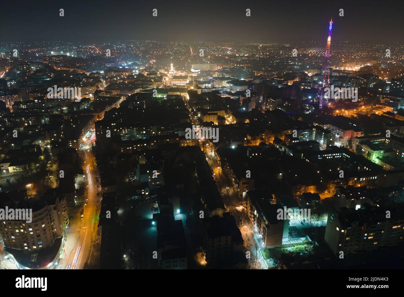 Aerial view of high rise apartment buildings and bright illuminated ...