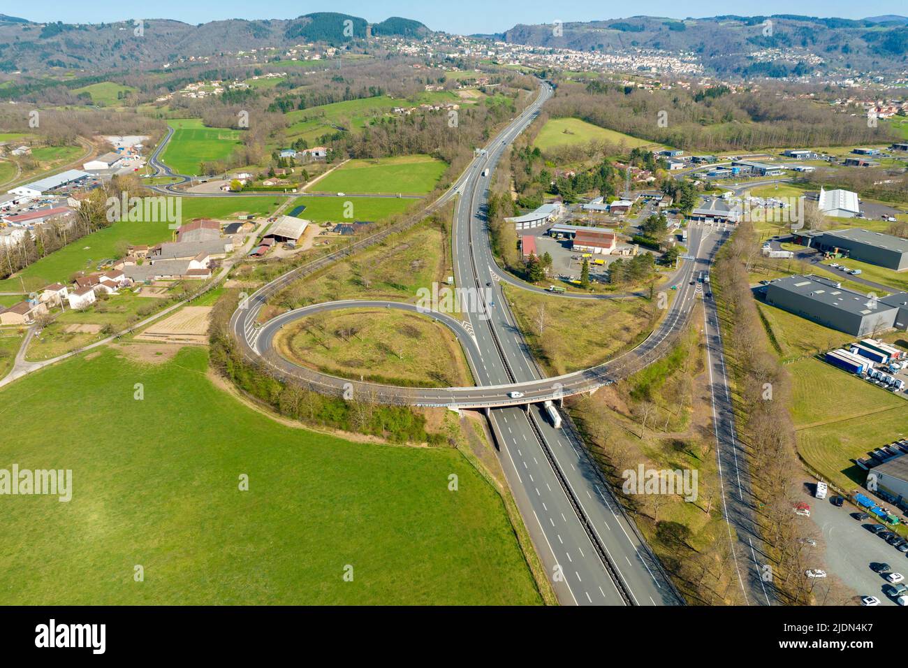 Aerial view of highway road intersection with fast moving heavy traffic ...