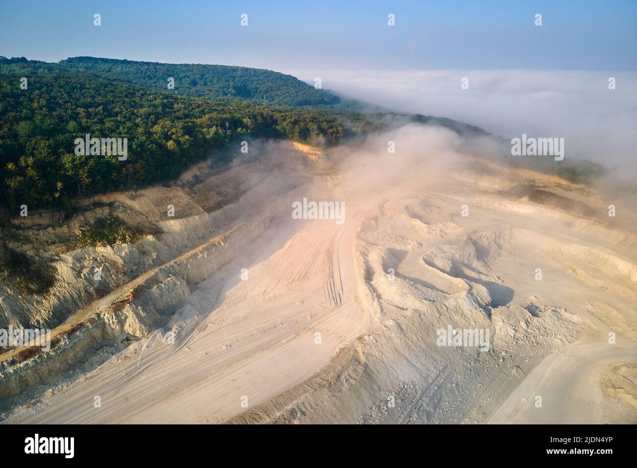 Aerial view of open pit mining site of limestone materials extraction ...