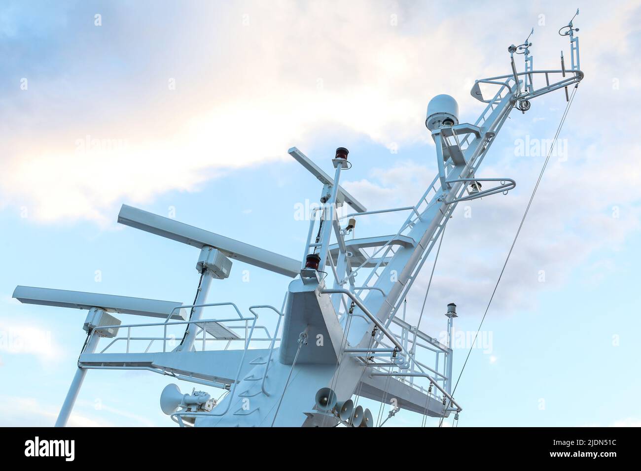 Ship structures, masts, antennas, funnel, ship wheelhouse against the ...