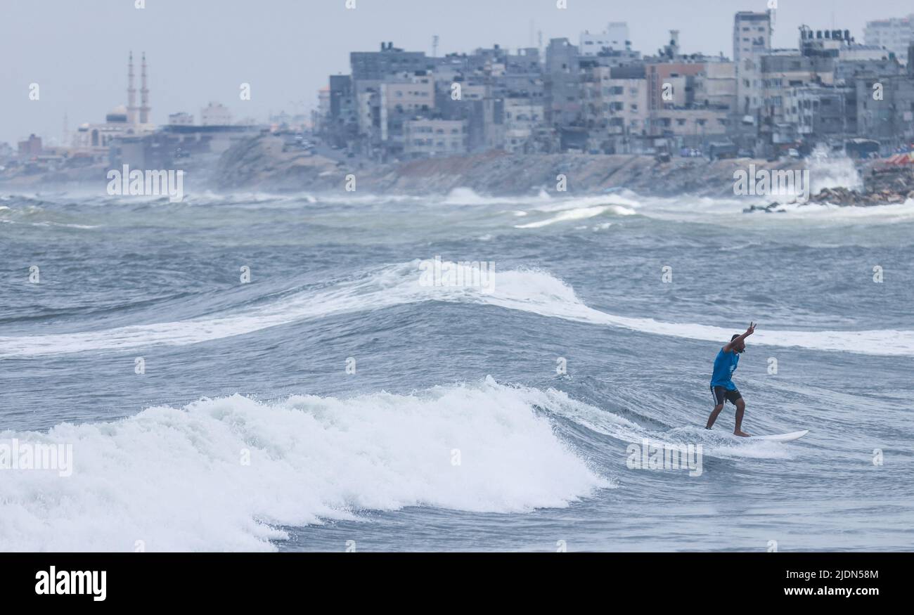 A Palestinian Athlete surfs on the waves during a surfing championship ...