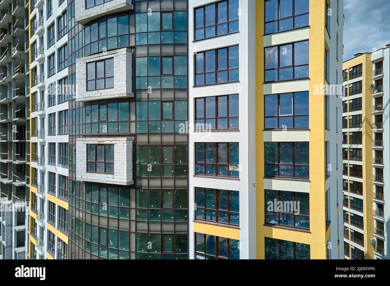 Architectural details of modern high apartment building facade with ...