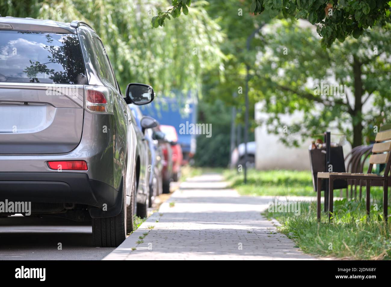 Cars parked in line on city street side. Urban traffic concept Stock ...