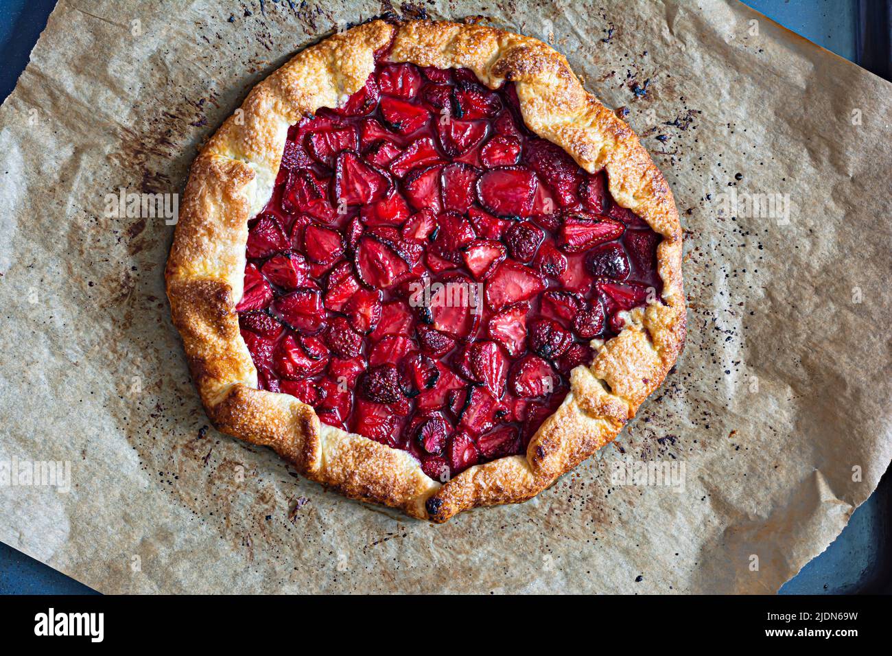 French dessert Galette with shortbread and strawberries. Open pie with ...
