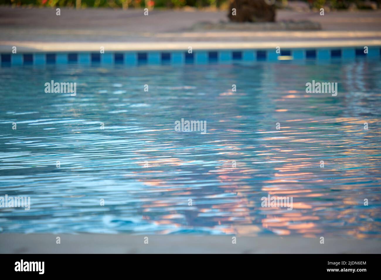 Closeup surface of blue clear water with small ripple waves in swimming ...