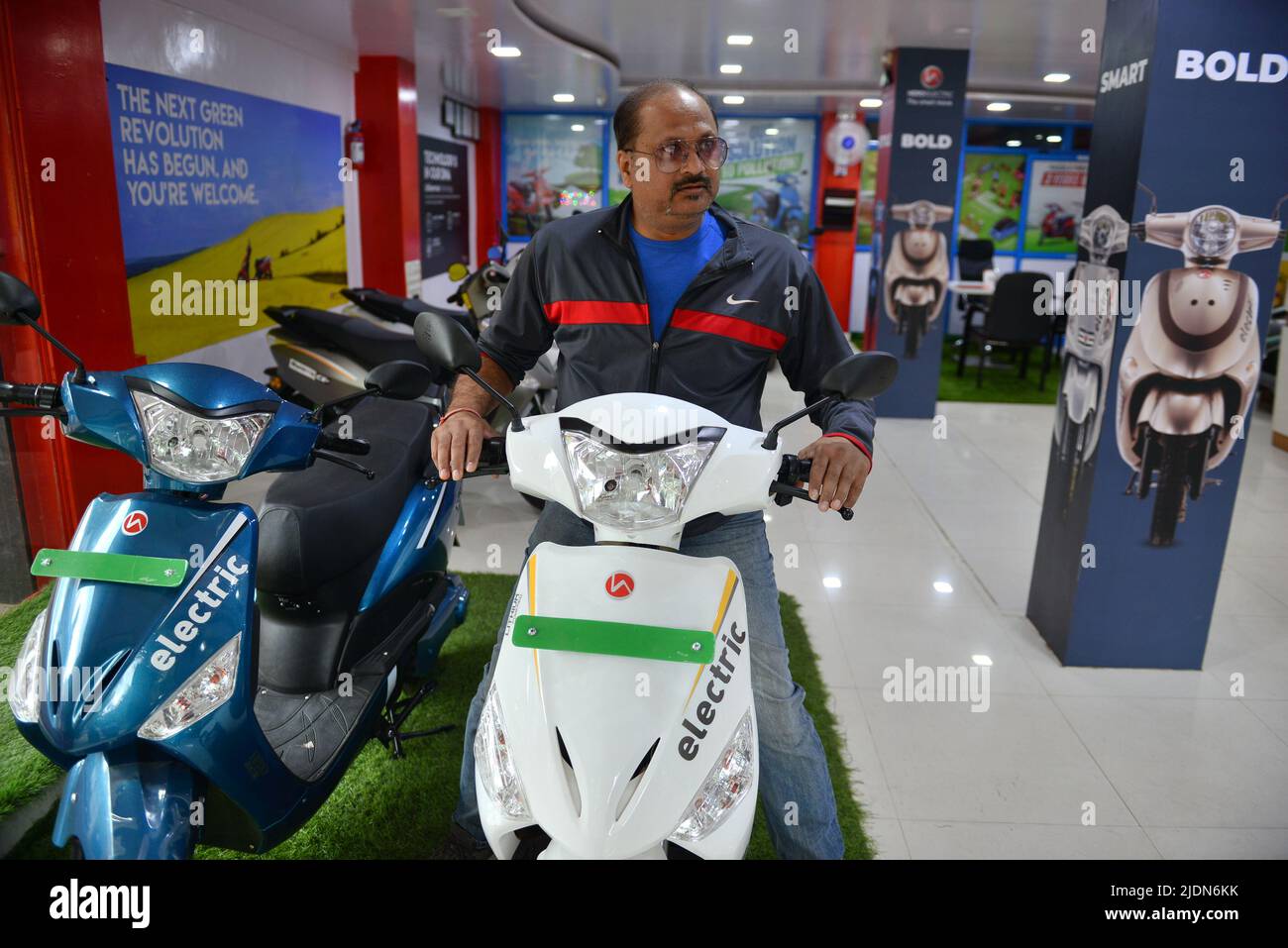 Customer tests an electric two-wheeler vehicle at the Hero Electric ...
