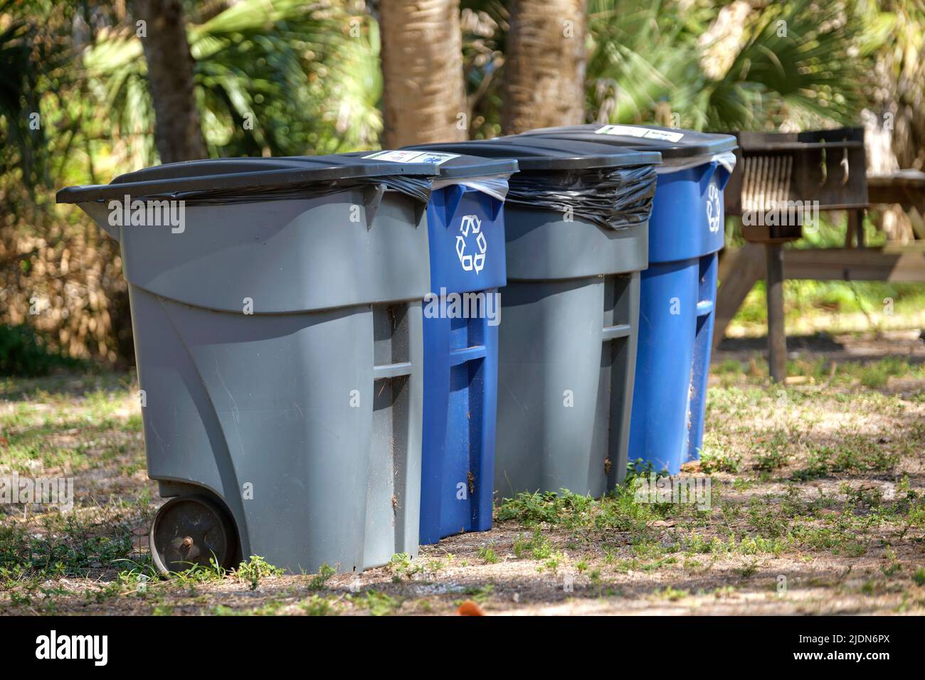 Garbage cans for separate disposal of recycle trash on city street ...