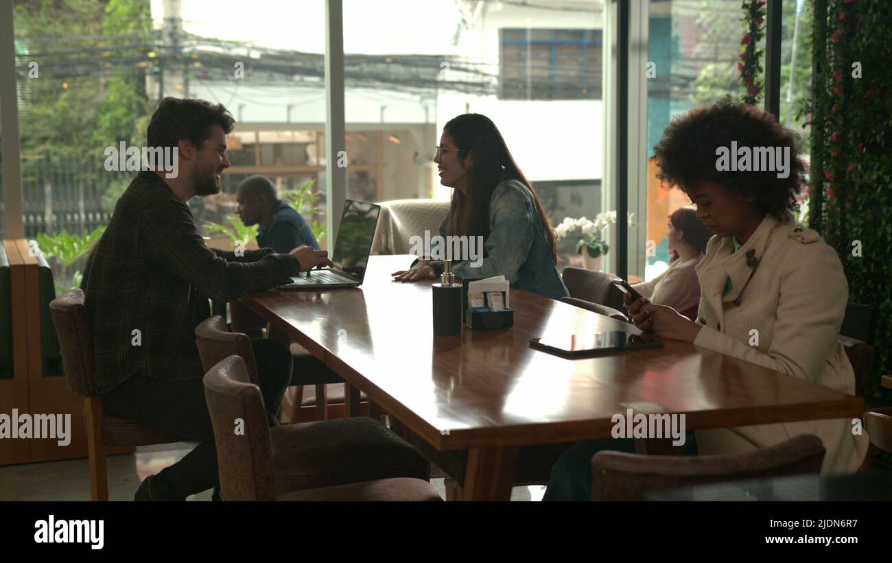 Customers inside coffee shop in conversation. Interior of cafe Stock ...