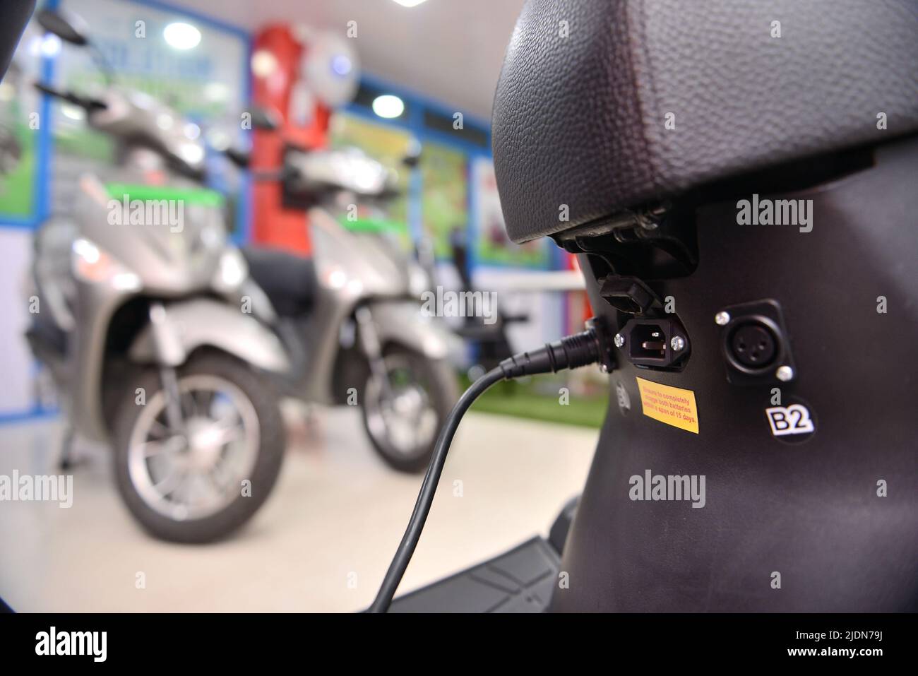 An electric two-wheeler vehicle seen charging at the Hero Electric ...