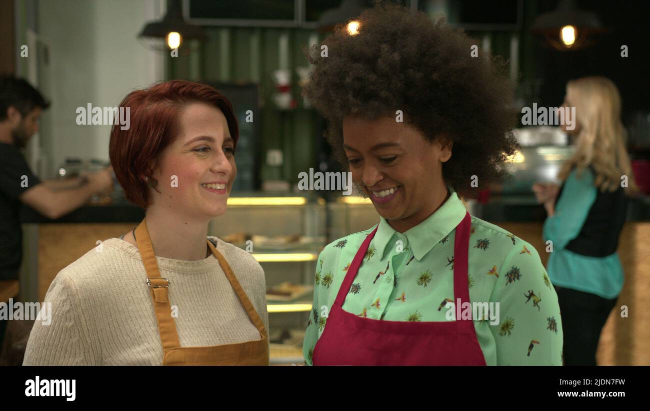 Female manager explaining small business Coffee shop to new employee ...