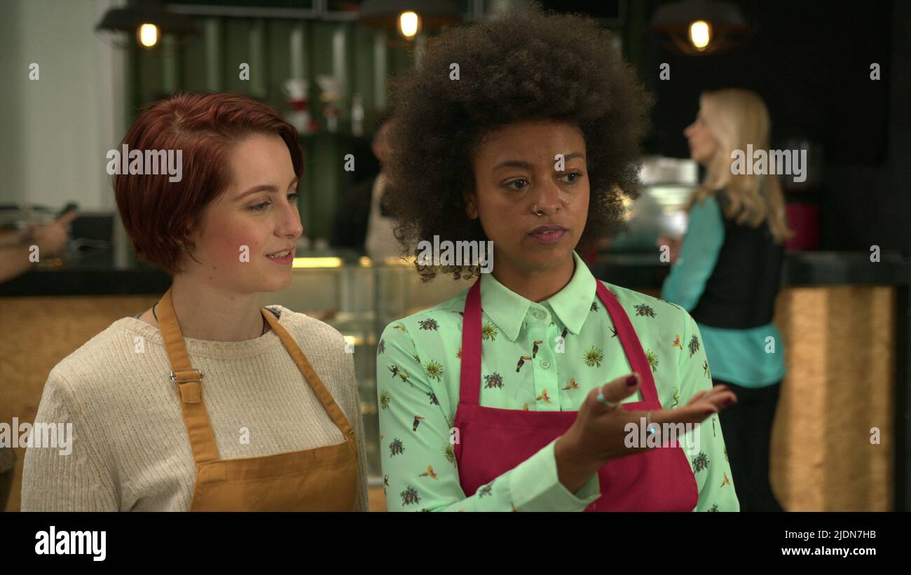 Female manager explaining small business Coffee shop to new employee ...