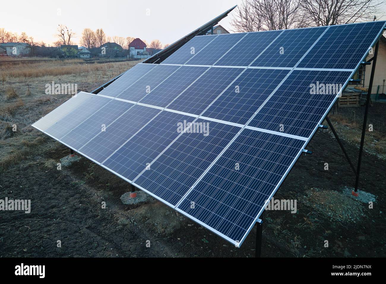 Solar photovoltaic panels mounted on stand-alone frame on backyard ...