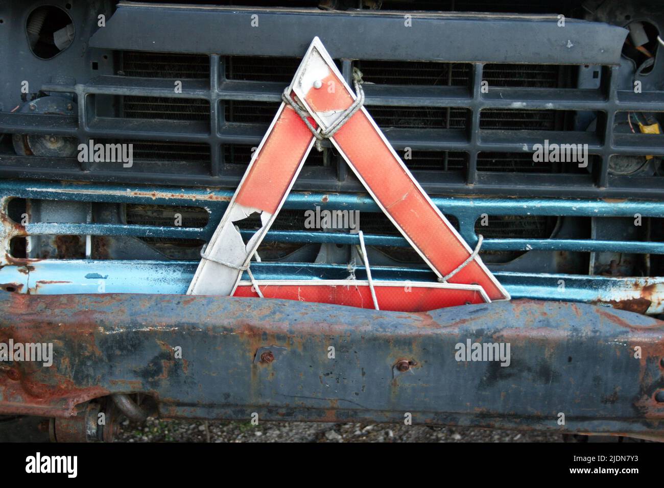 Damaged car with warning triangle Stock Photo - Alamy