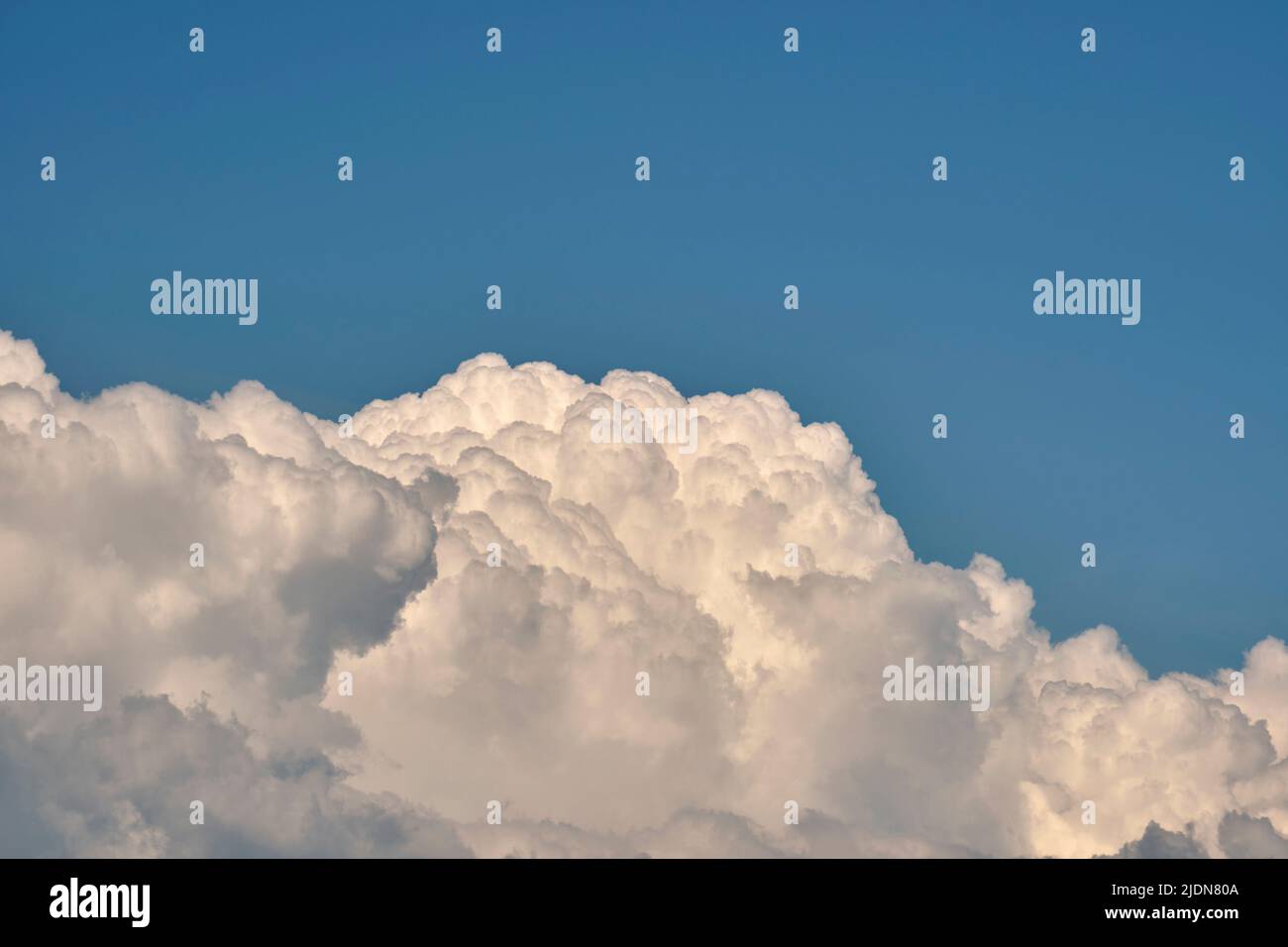 White puffy cumulus clouds on summer blue sky Stock Photo - Alamy