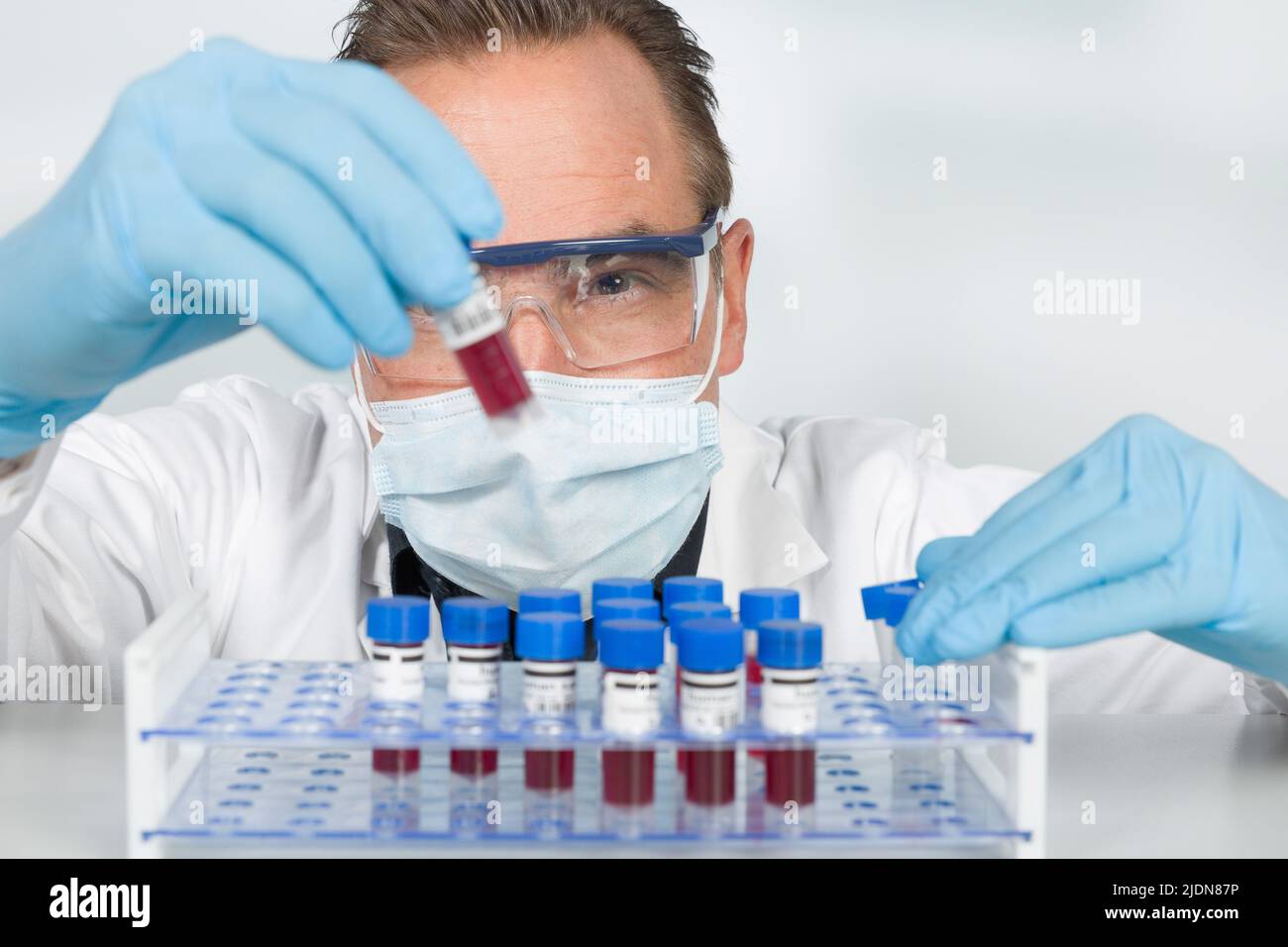 Scientist working laboratory tubes hi-res stock photography and images ...