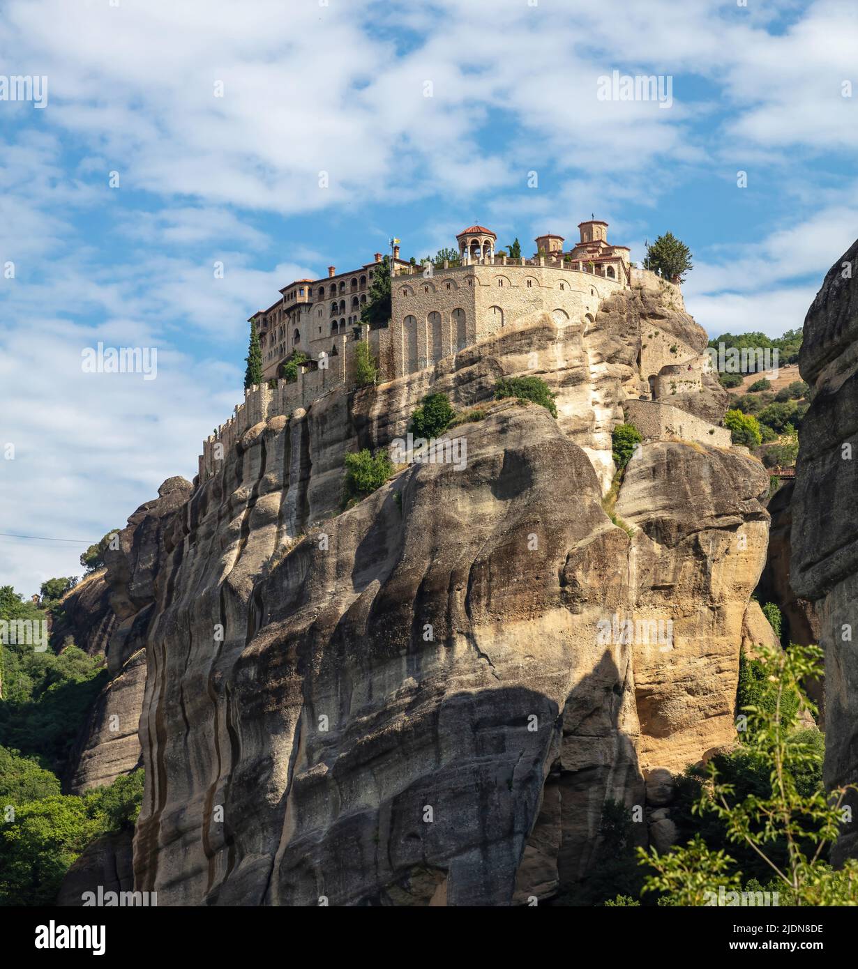 Meteora Greece. Varlaam Holy Monastery buildings on top of rocks, blue ...