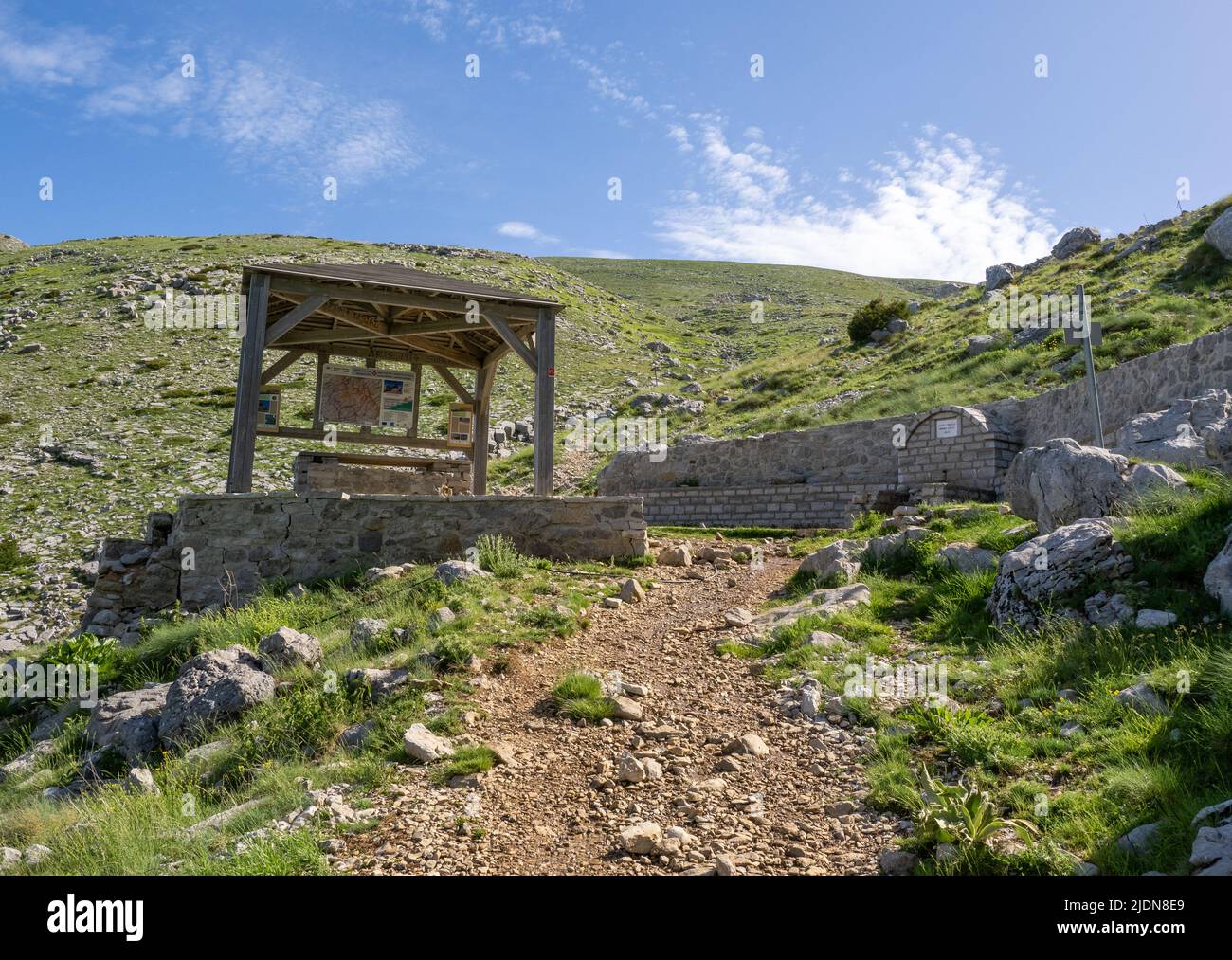 Wooden shelter by a mountain spring on the popular climb from Mikro ...
