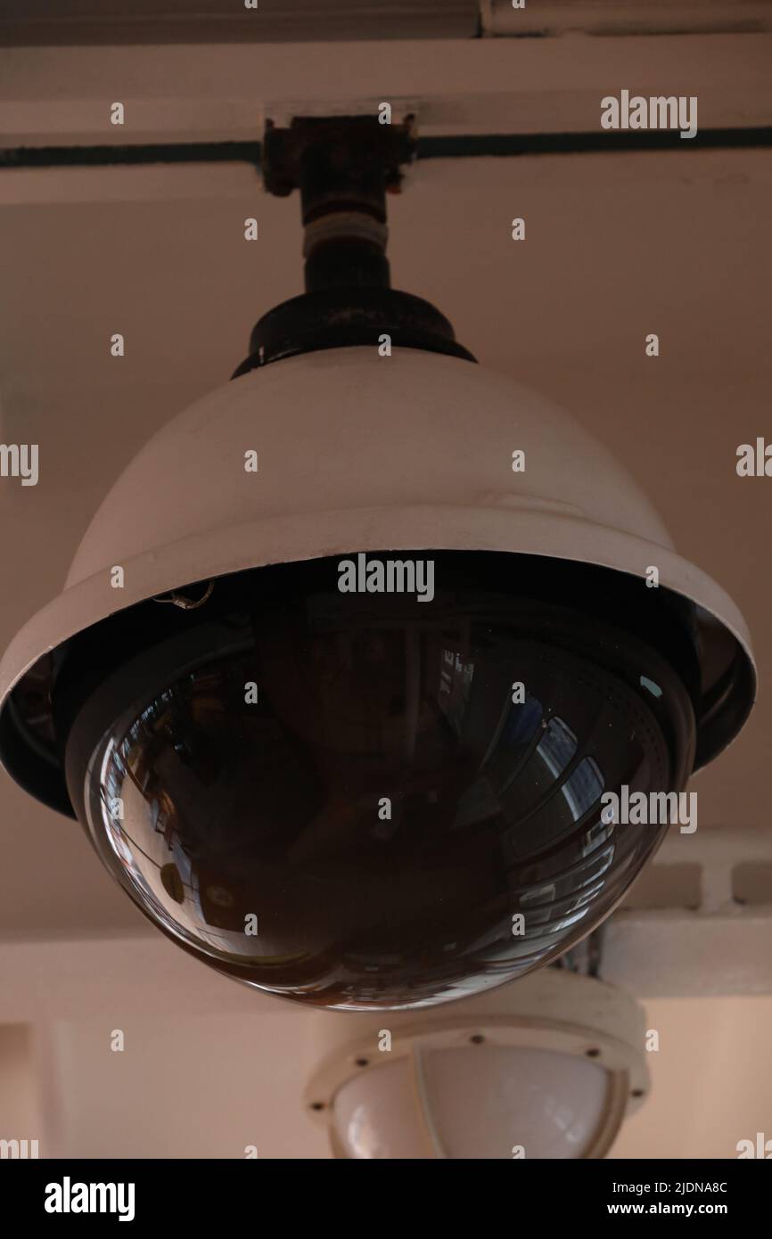 Surveillance cameras and a loudspeaker on the bulkhead of the ship's ...
