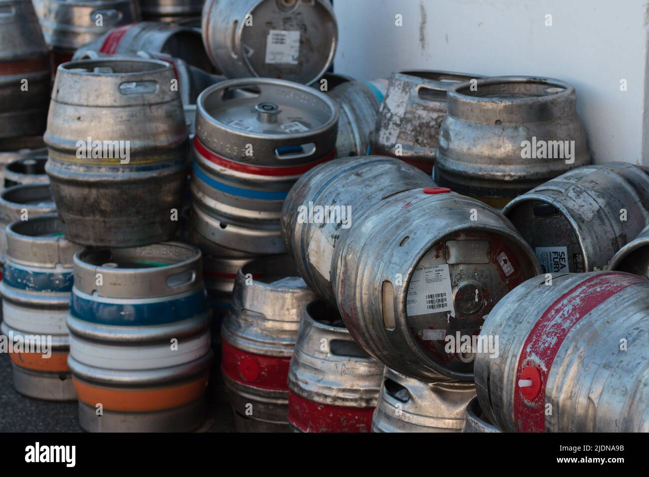 Metal beer kegs stacked outside of a pub Stock Photo - Alamy