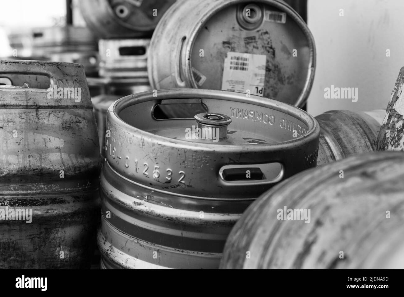 Metal beer kegs stacked outside of a pub Stock Photo - Alamy