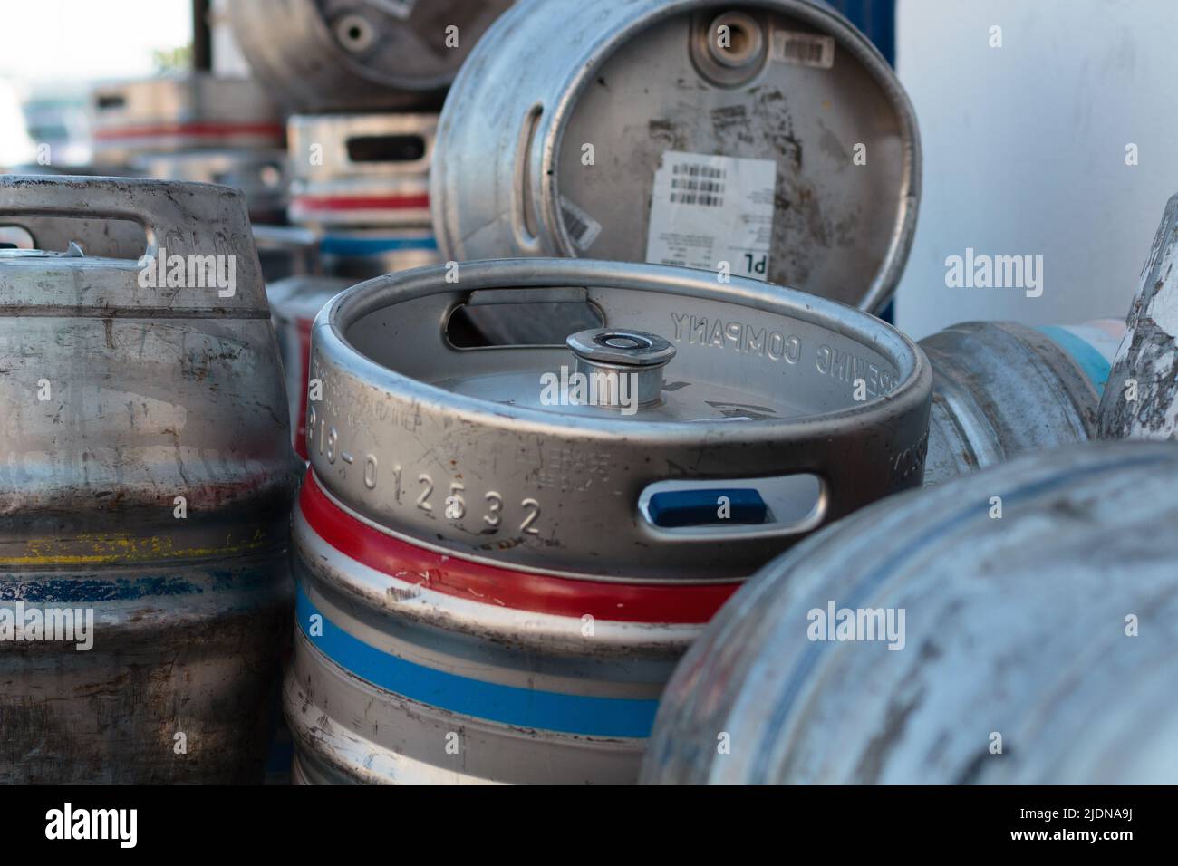 Metal beer kegs stacked outside of a pub Stock Photo - Alamy