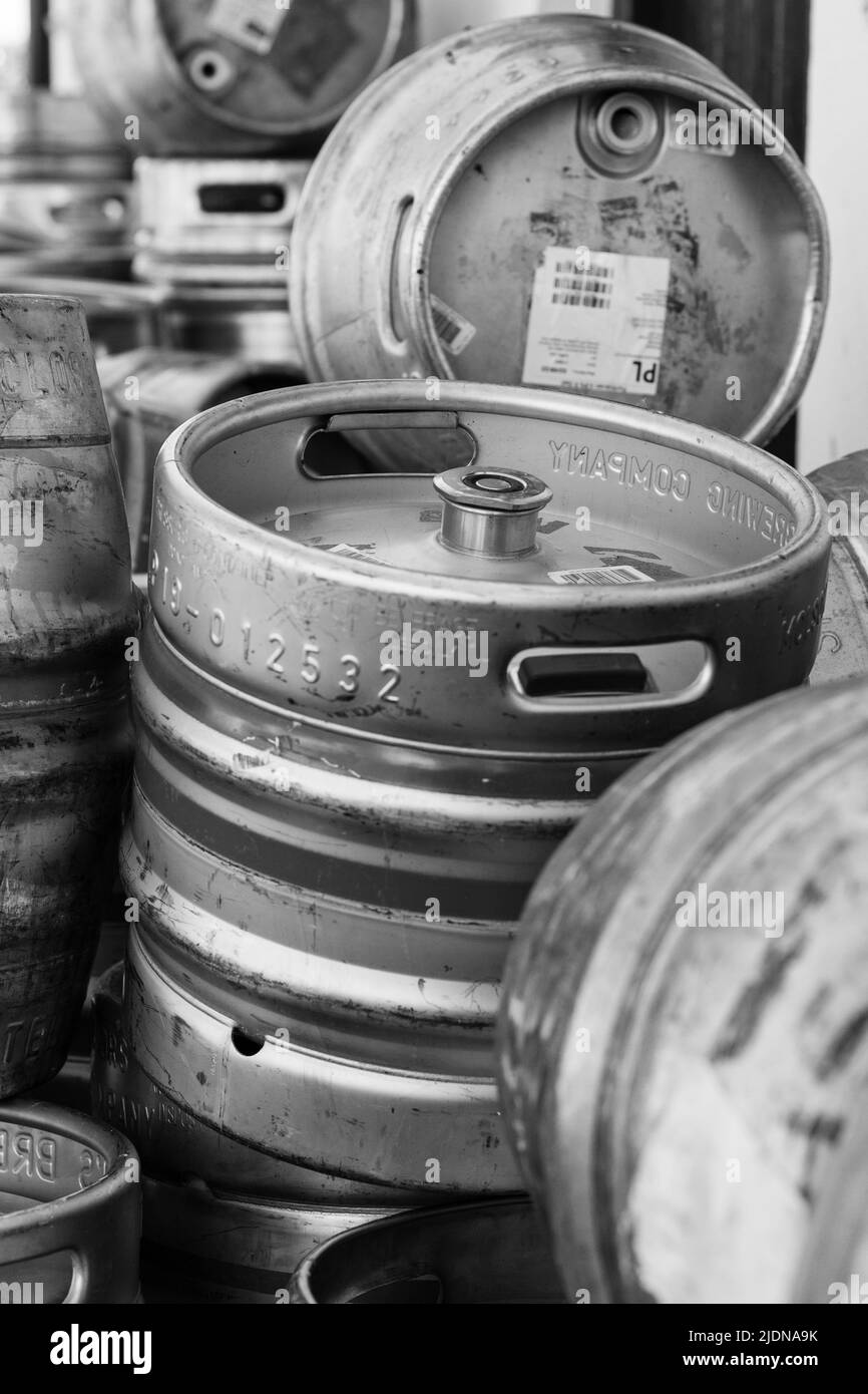 Metal beer kegs stacked outside of a pub Stock Photo - Alamy