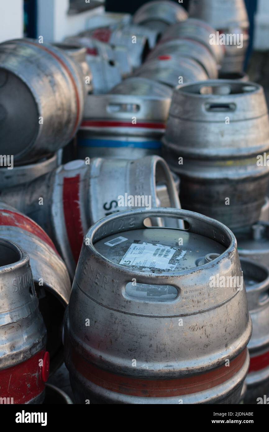 Metal beer kegs stacked outside of a pub Stock Photo - Alamy