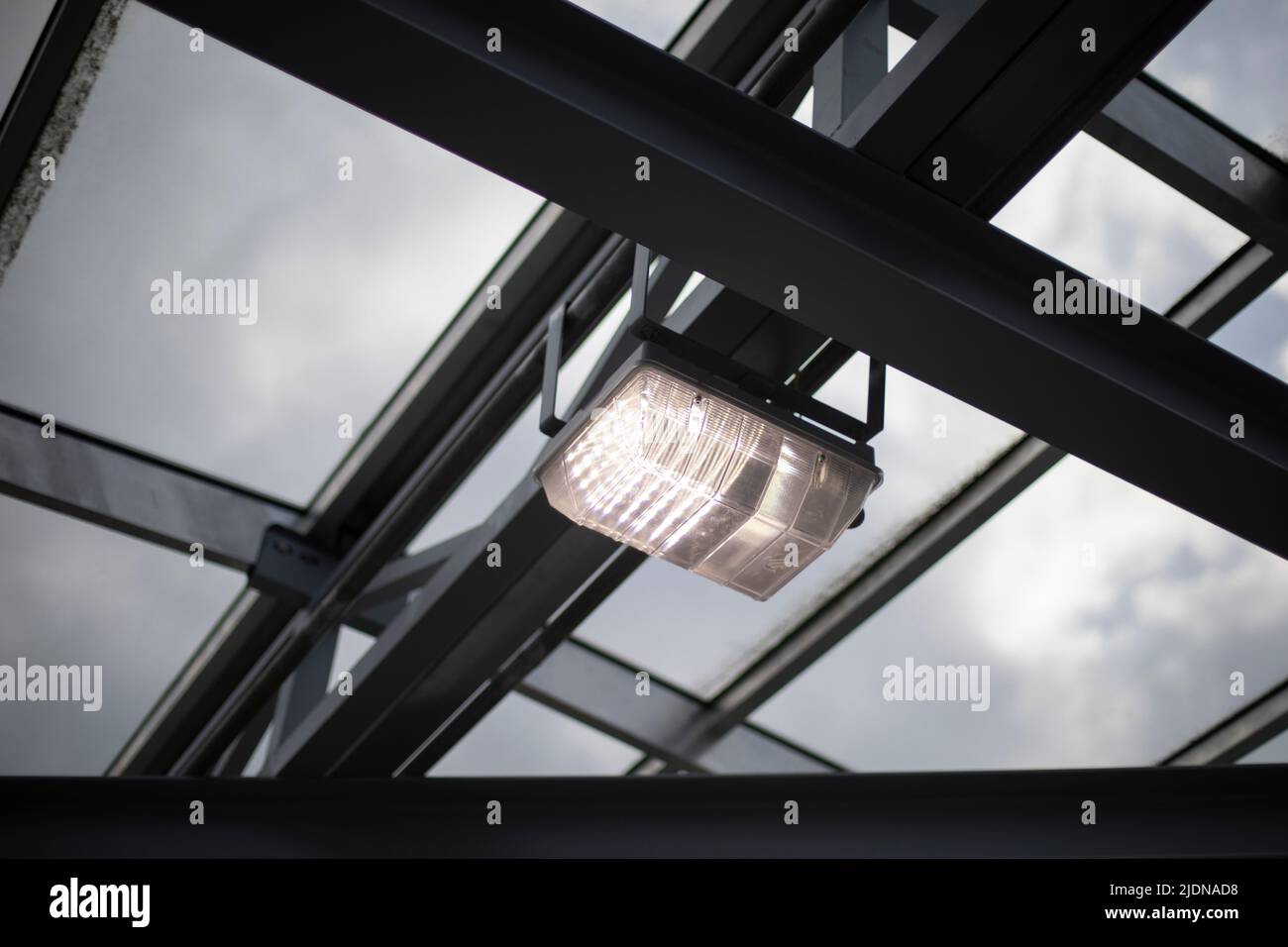 Lamp in tunnel. Details of bridge. Steel beams of bridge. Light on ...
