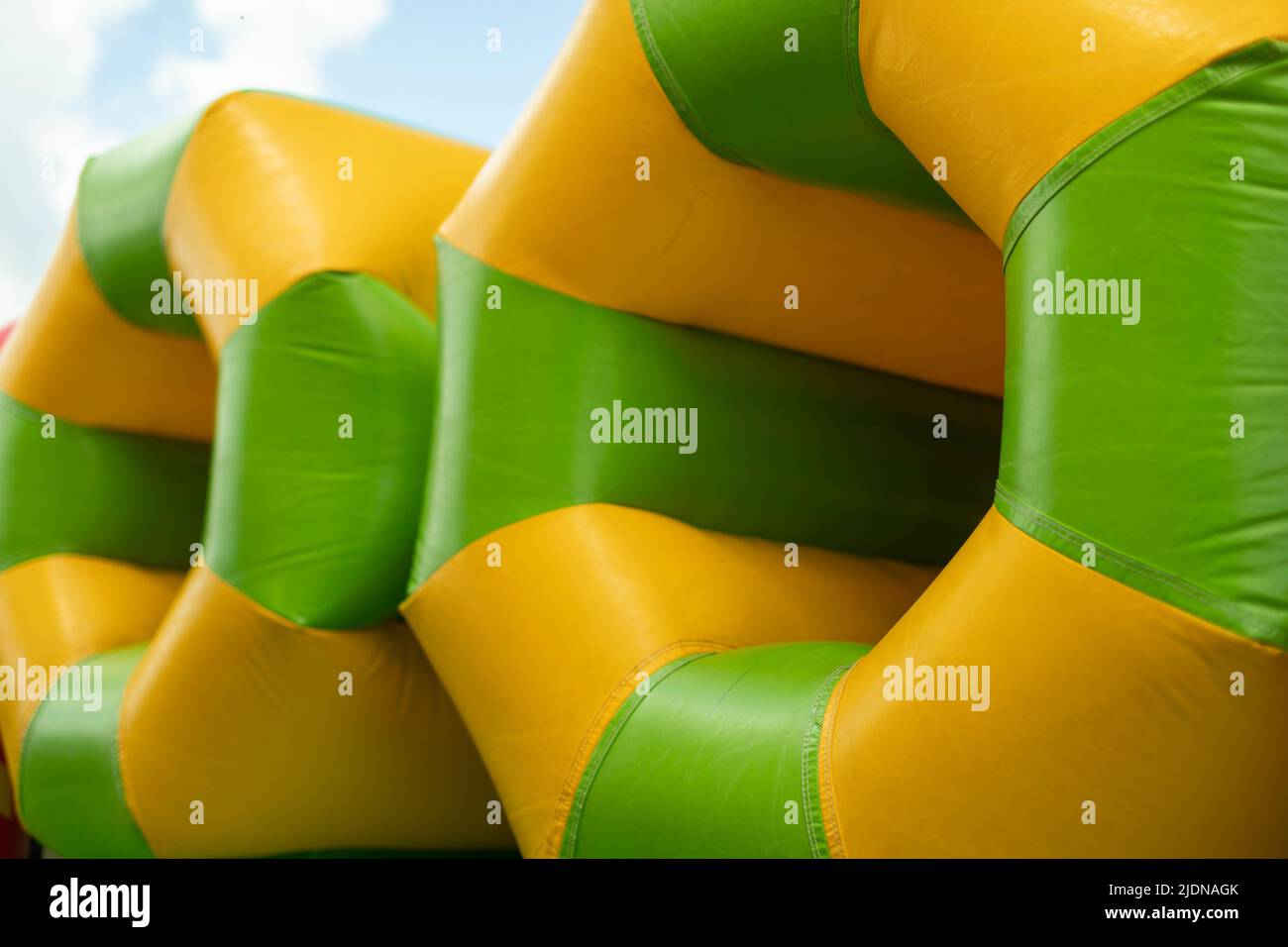 Inflatable pipe on playground. Obstacle course in amusement park ...