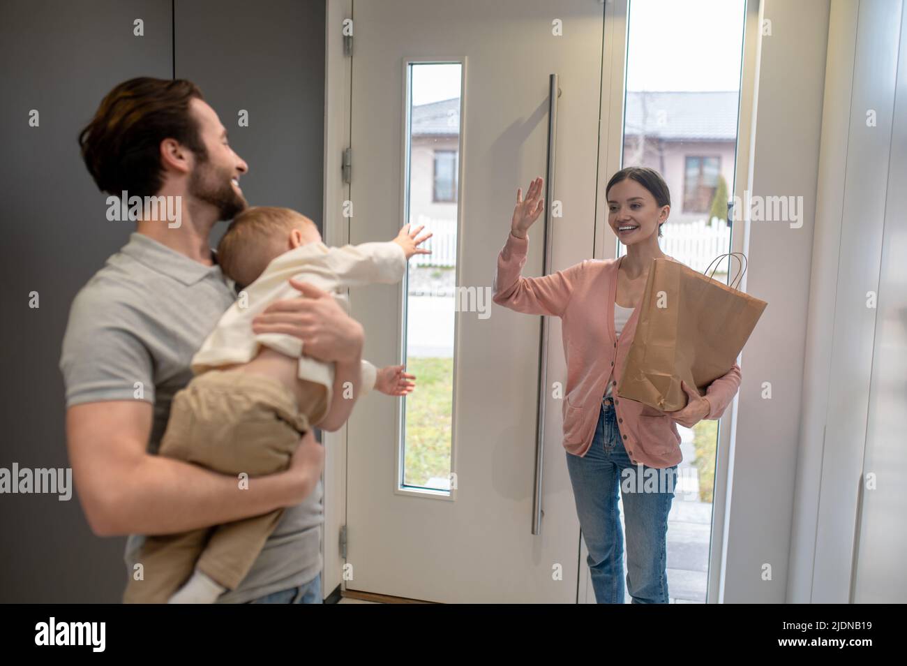 Mom coming from the market while dad playing with a baby Stock Photo ...