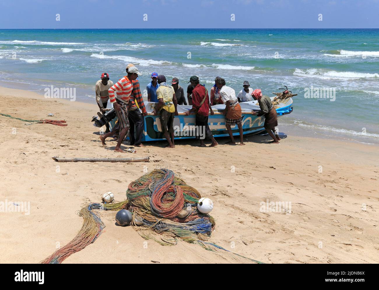 Traditional fishing hauling nets Nilavelli beach , near Trincomalee ...