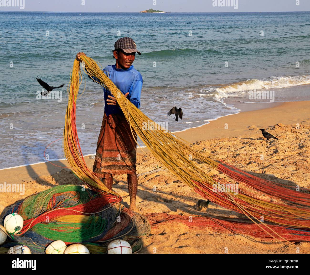 Traditional fishing hauling nets Nilavelli beach , near Trincomalee ...