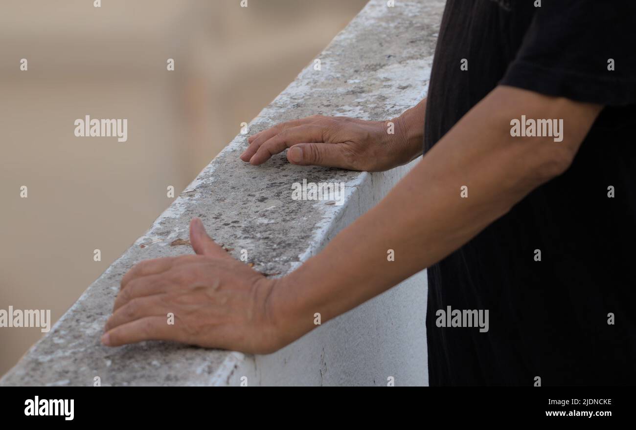 Hands on railing hi-res stock photography and images - Alamy