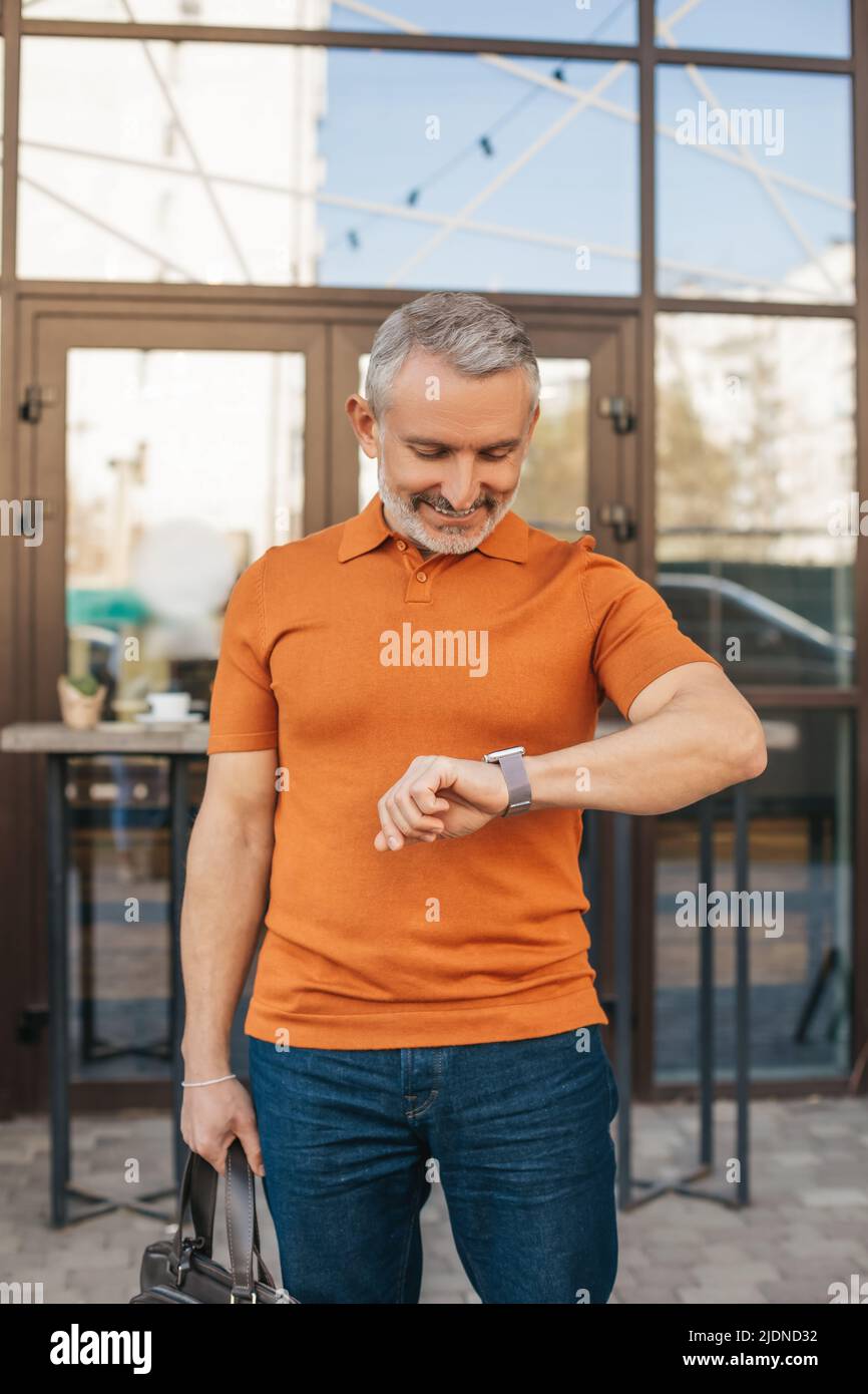 Man looking watch door hi-res stock photography and images - Alamy