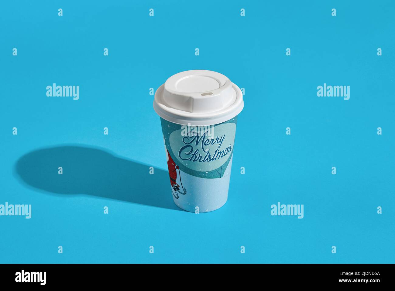 Hot coffee in blue winter paper cup with white lid on blue backg Stock ...