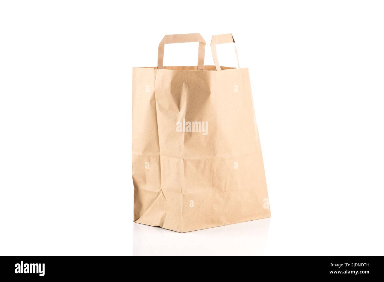 Simple paper bag isolated on a white background Stock Photo - Alamy