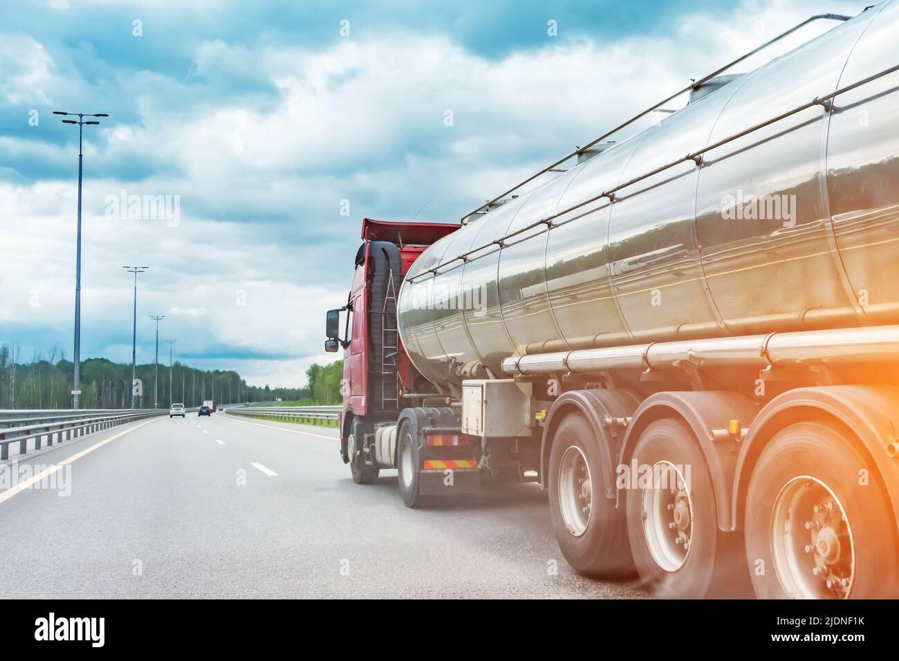 Big metal fuel tanker truck shipping fuel on the countryside road ...